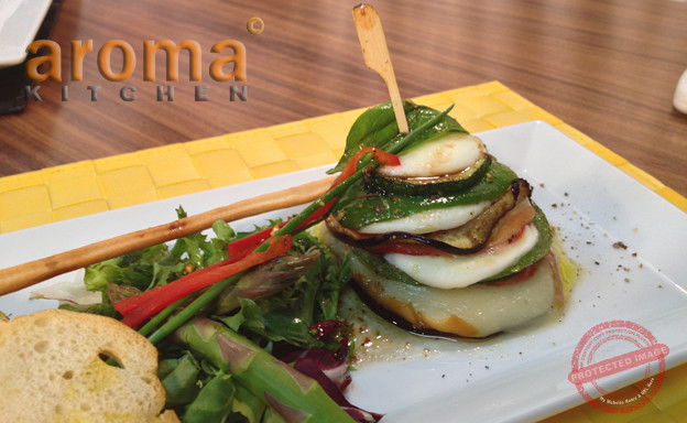 Baked vegetable stacks served with melted buffola cheese and honey ...